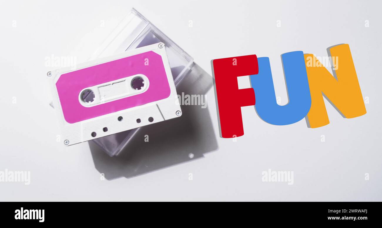 Image of fun text over tape on white background Stock Photo - Alamy