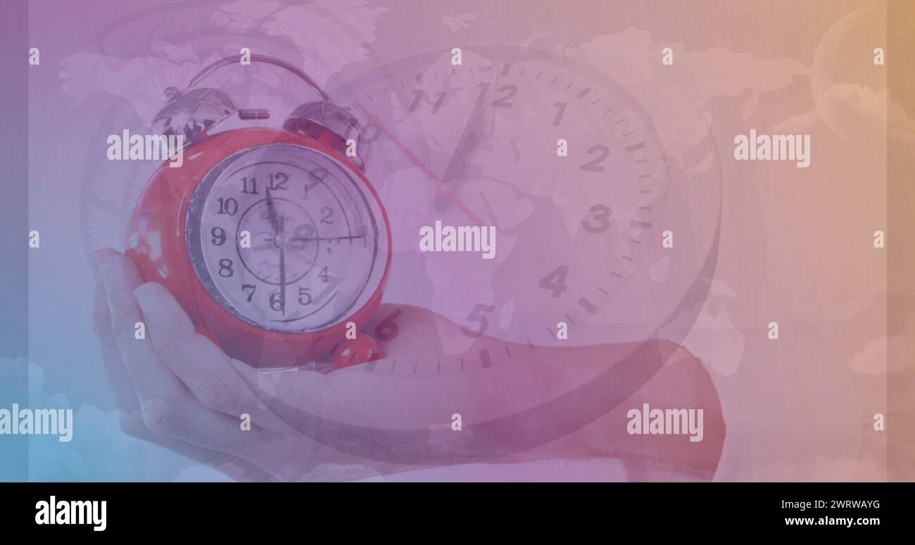 Image of clock over hand holding clock Stock Photo - Alamy