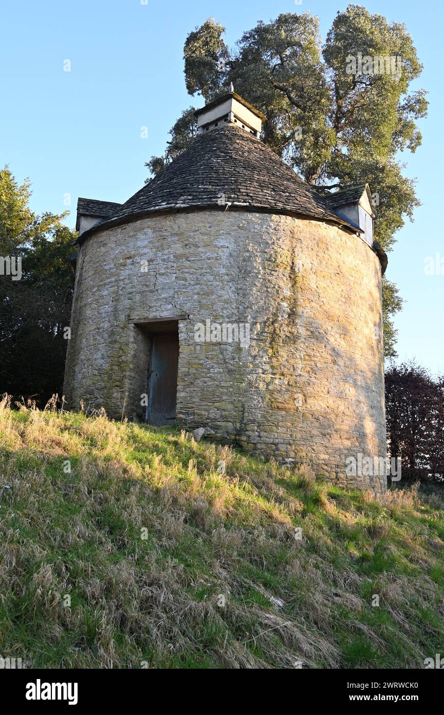 Stone built dovecot in the grounds of Kiddington Hall a mansion in the ...