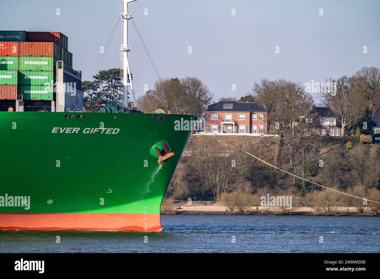 Container ship Ever Gifted, enters the port of Hamburg on the Elbe ...