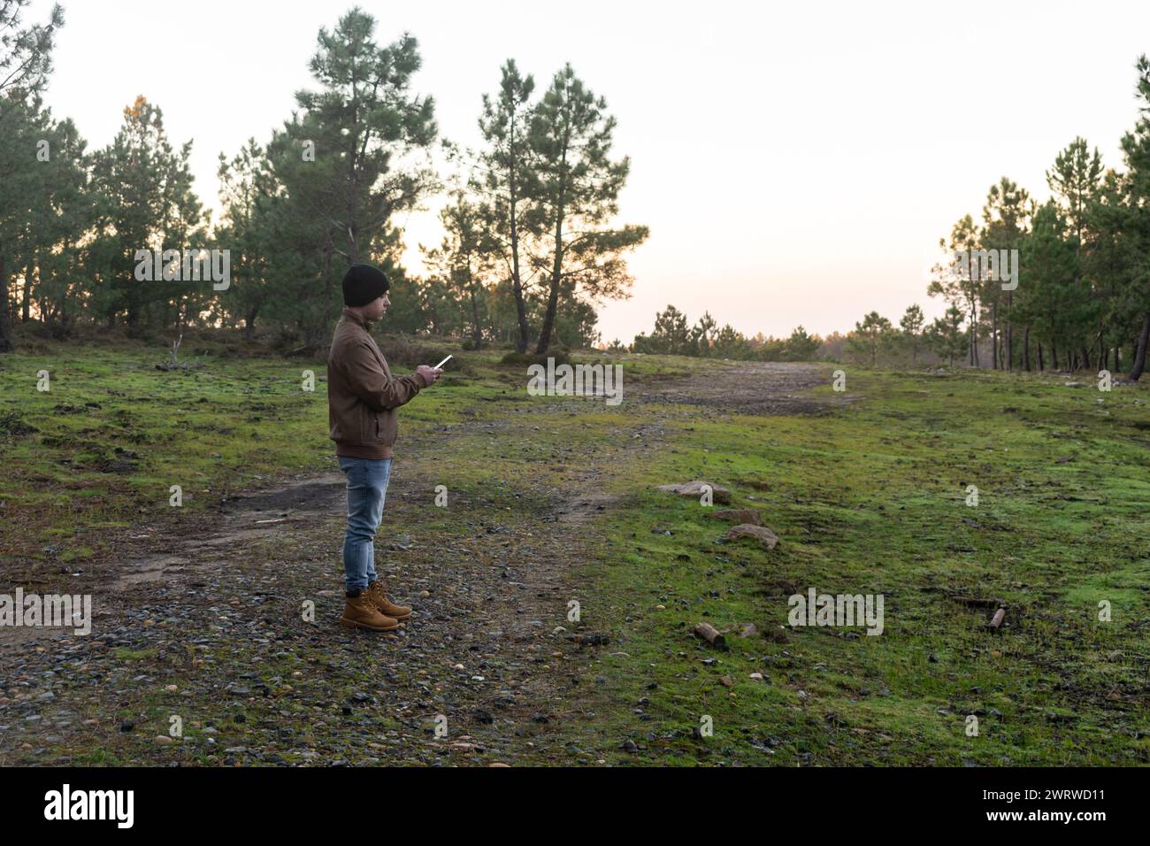 Young hiker using mobile hi-res stock photography and images - Alamy