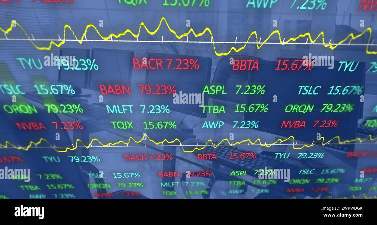 Image of graphs and trading board moving over desktops and keyboards on ...