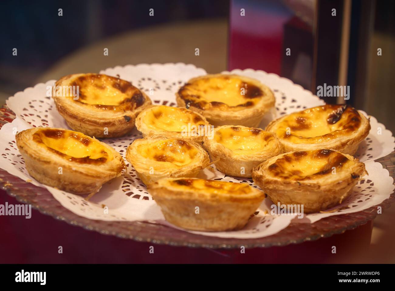 Assorted Pastel De Nata Pastries Elegantly Displayed on a Lace Doily ...