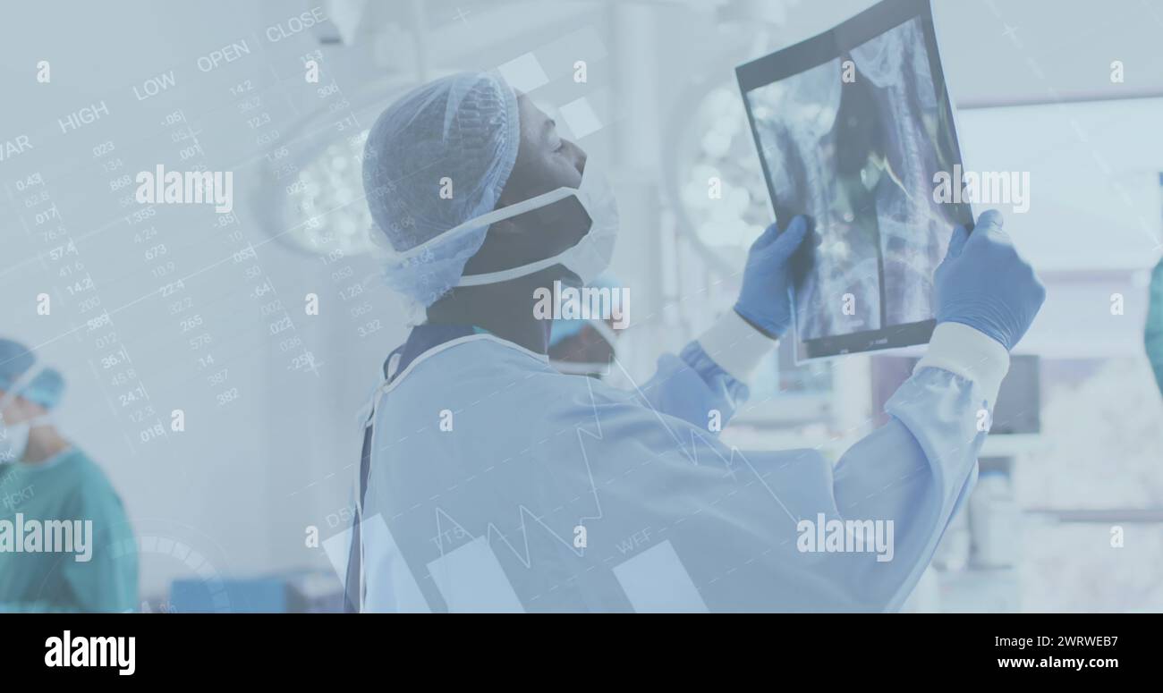 Image of infographic interface, african american doctor anaylzing x-ray ...