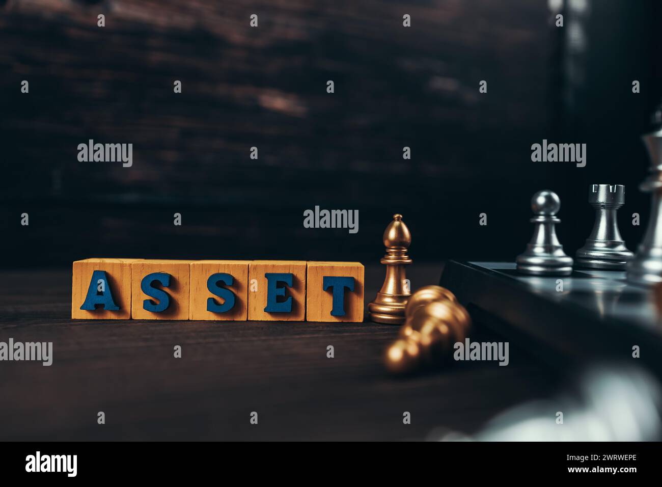 wood word "asset" and chess piece on chess board game for ideas ...