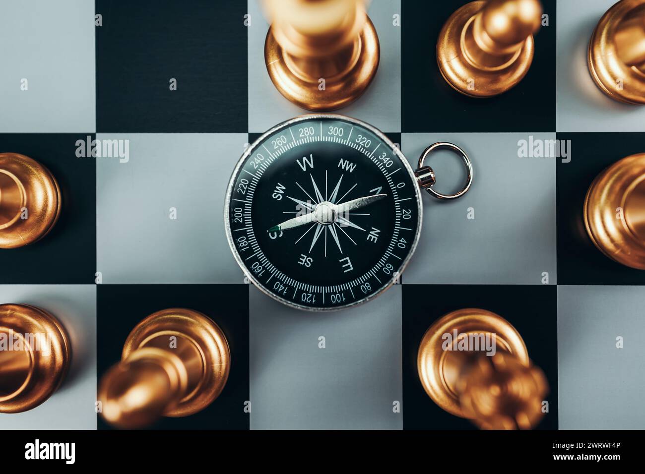 compass and chess piece on chess board game for ideas, challenge ...