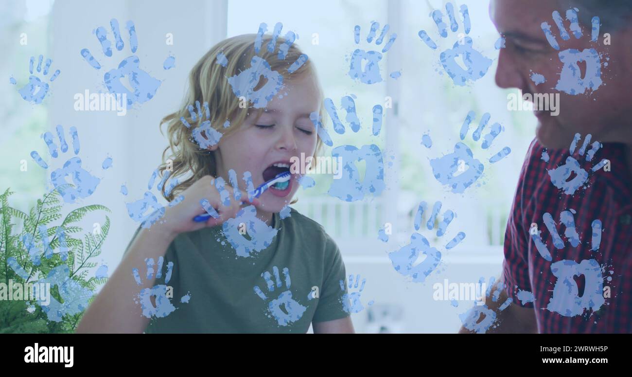 Image of handprints over caucasian boy brushing teeth Stock Photo - Alamy