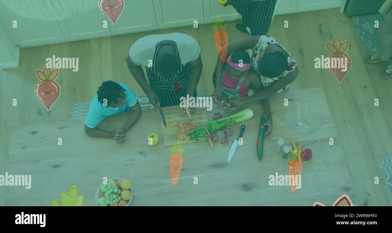 Image of vegetables falling over african american family cooking ...