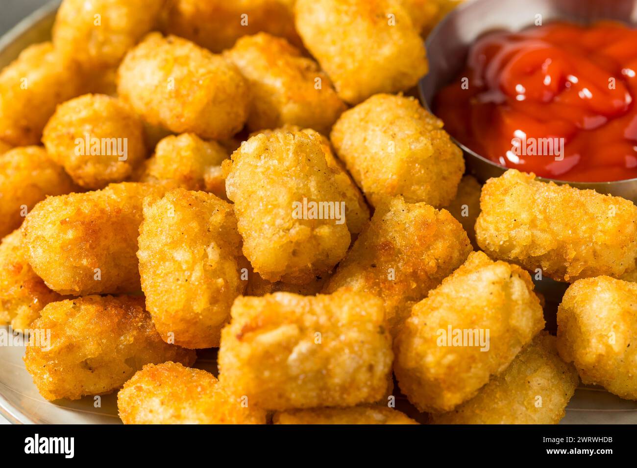 Homemade Baked Fried Tater Tot Potatoes with Ketchup Stock Photo - Alamy