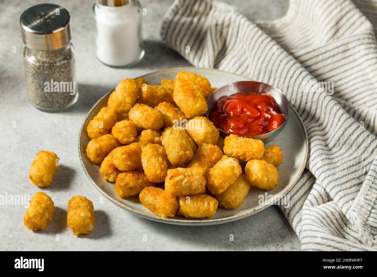 Homemade Baked Fried Tater Tot Potatoes with Ketchup Stock Photo - Alamy