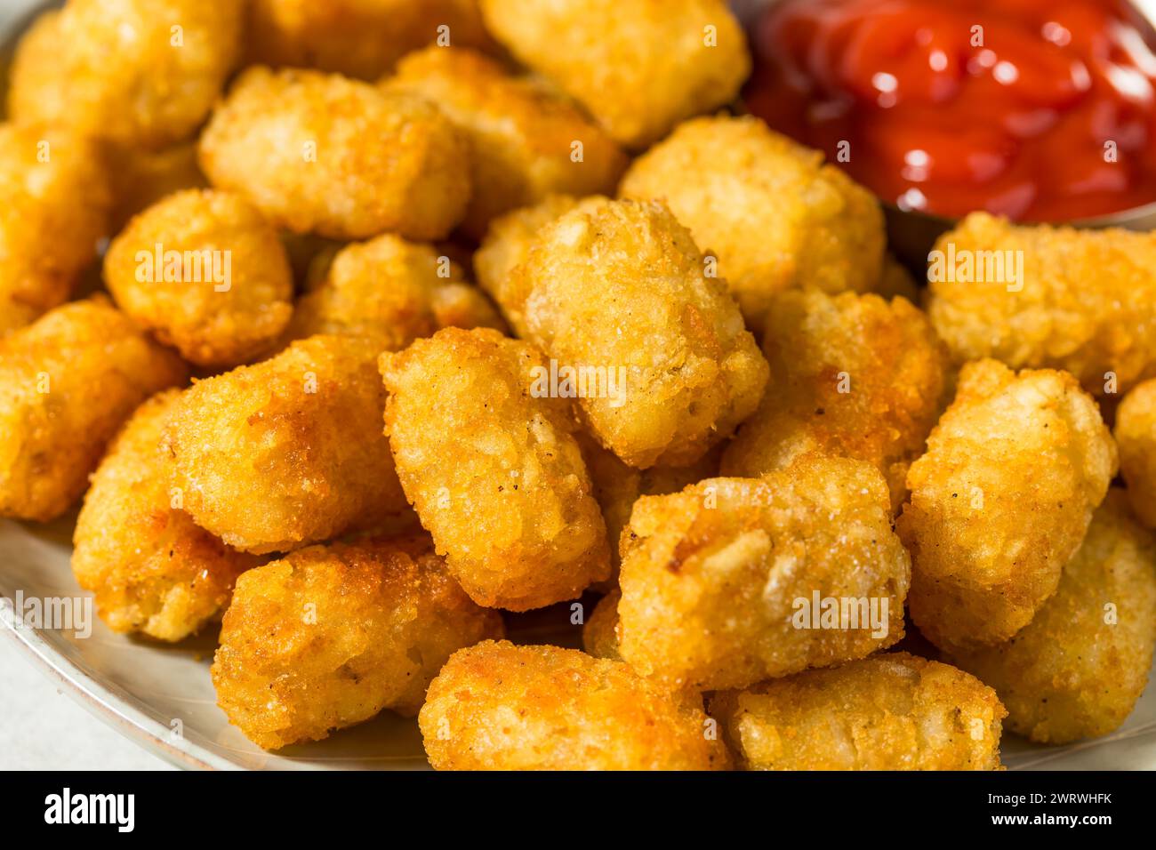Homemade Baked Fried Tater Tot Potatoes with Ketchup Stock Photo - Alamy