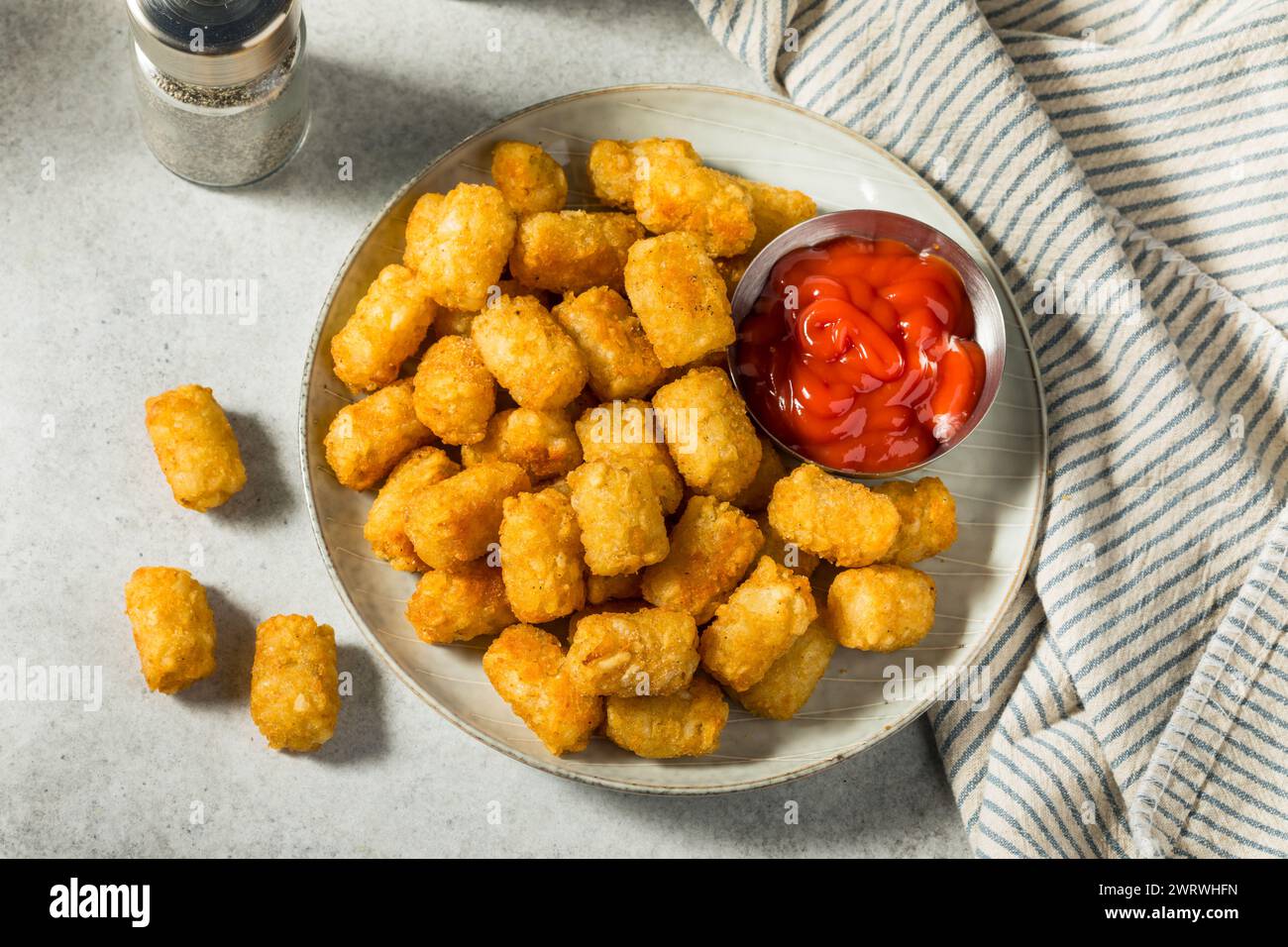 Homemade Baked Fried Tater Tot Potatoes with Ketchup Stock Photo - Alamy