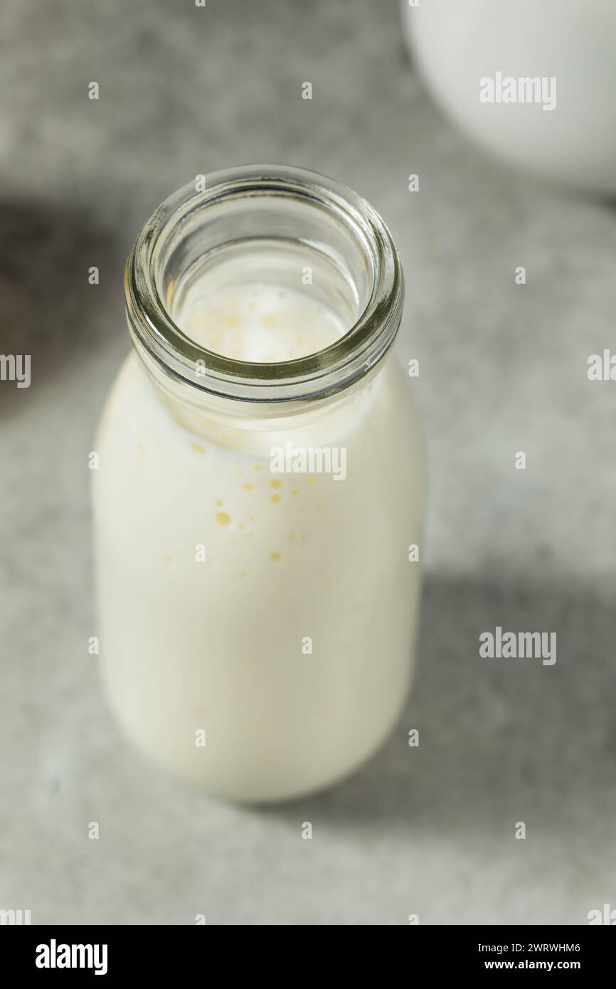 Cold Refreshing White Buttermilk in a Milk Glass Stock Photo - Alamy