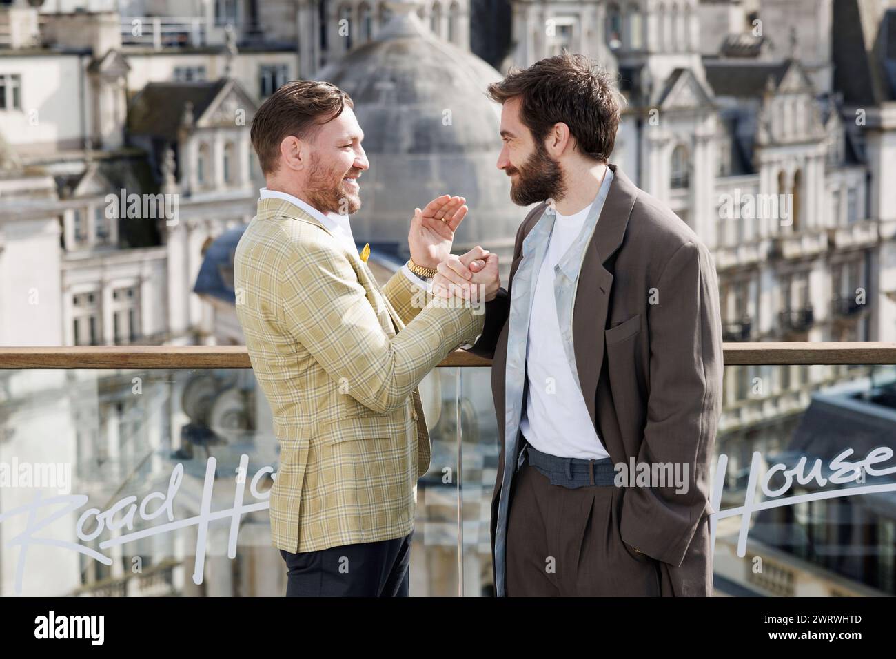 Conor McGregor and Jake Gyllenhaal, right, pose for photographers ...