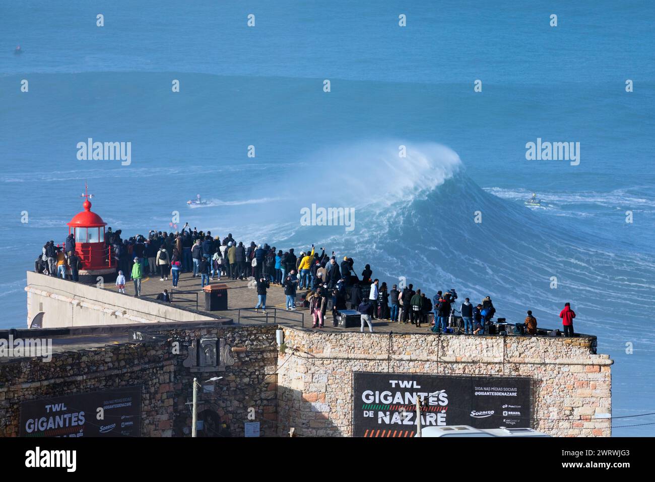 Europe, Portugal, Oeste Region, Nazaré, Crowd watching the Huge Waves ...