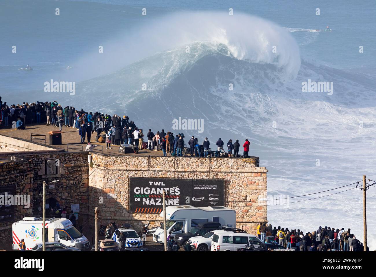 Europe, Portugal, Oeste Region, Nazaré, Crowd watching the Huge Waves ...