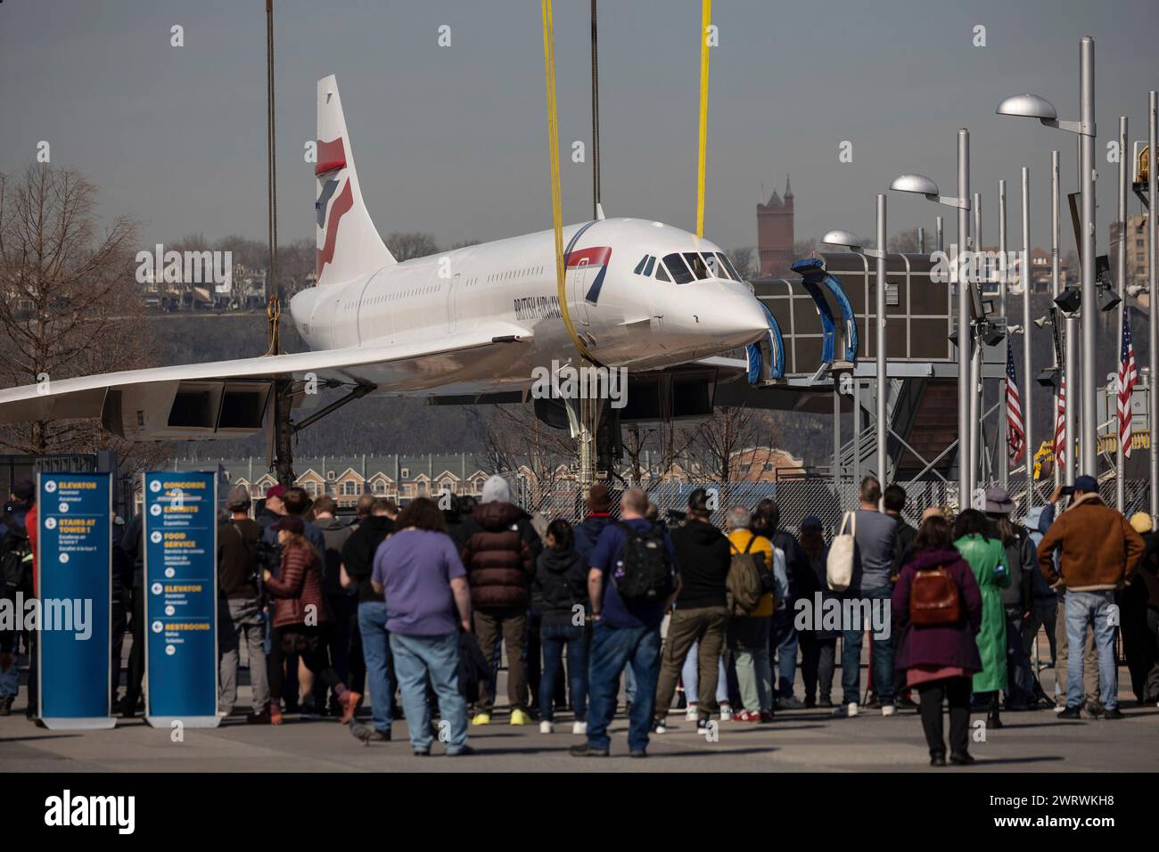 People watch a retired British Airways Concorde supersonic aircraft is ...