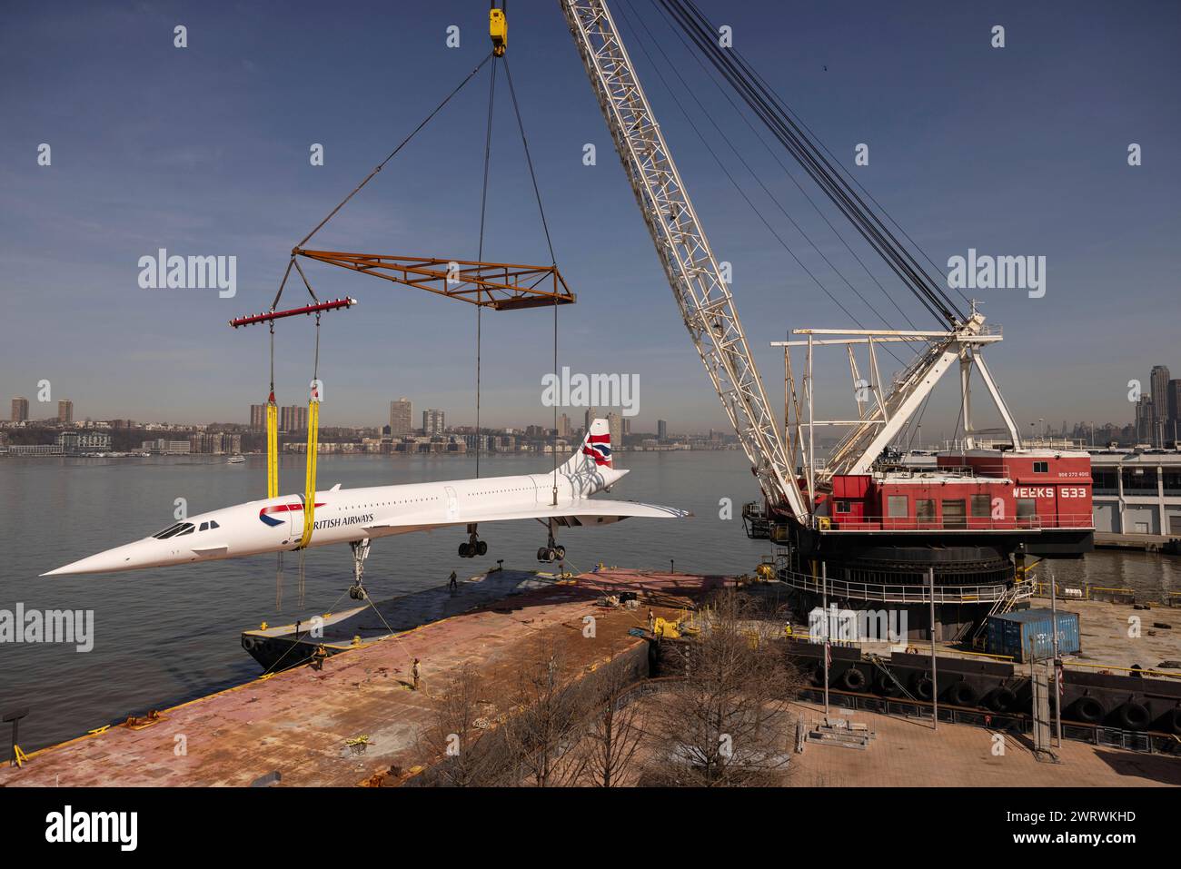 A retired British Airways Concorde supersonic aircraft is lifted by a ...