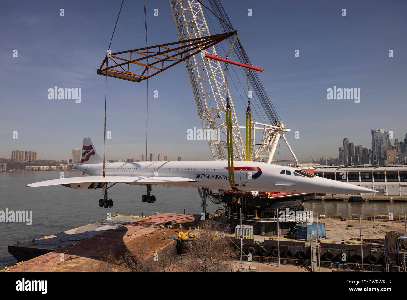 A retired British Airways Concorde supersonic aircraft is lifted by a ...