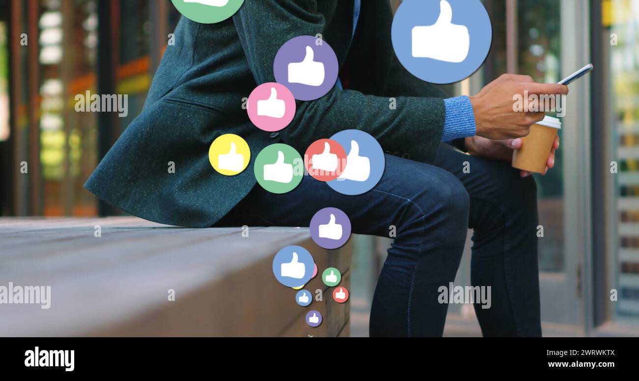 Close up side view of a man checking his on while sitting on a brick ...