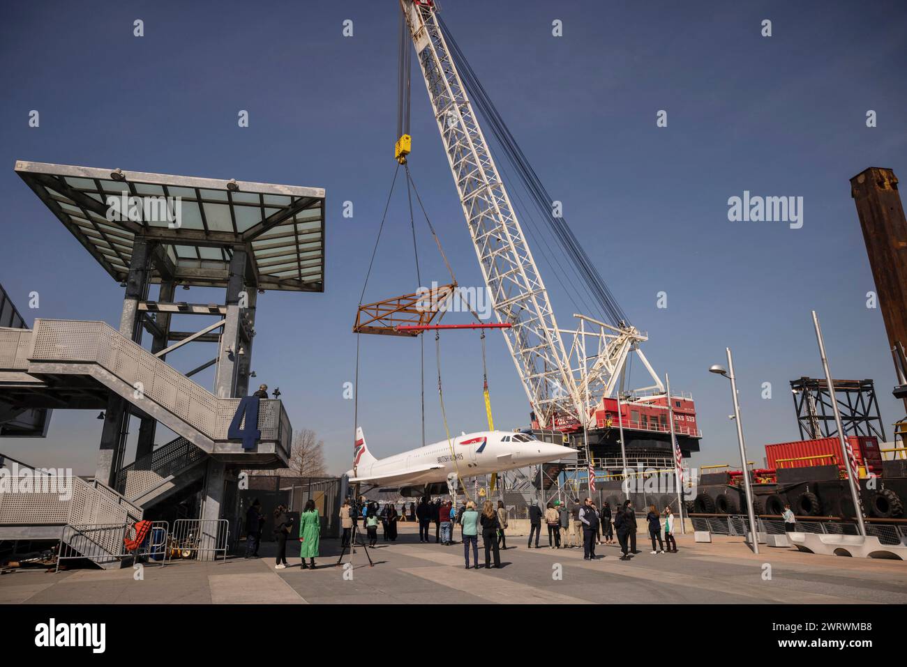 People watch a retired British Airways Concorde supersonic aircraft sit ...