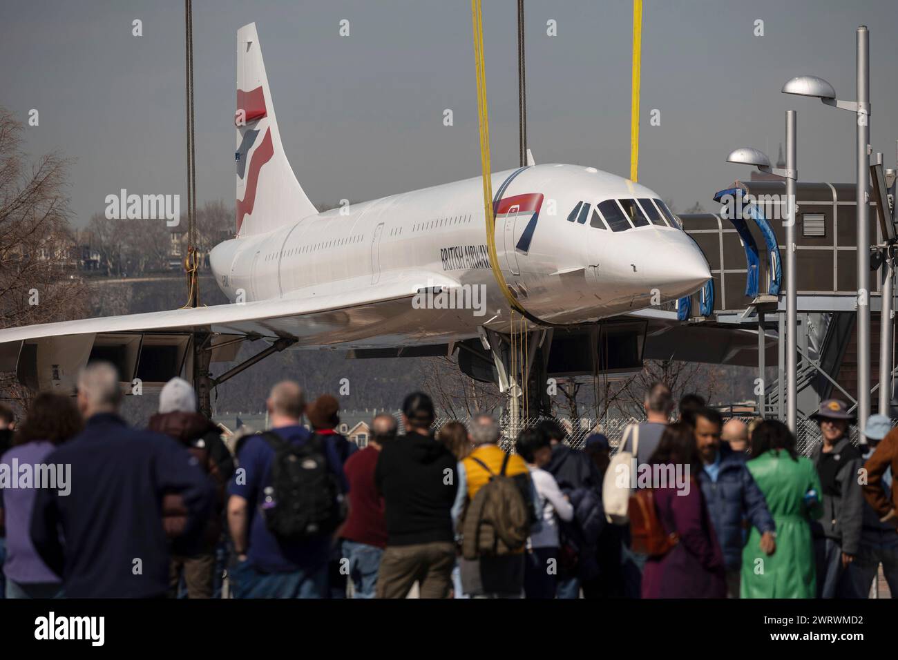 People watch a retired British Airways Concorde supersonic aircraft get ...