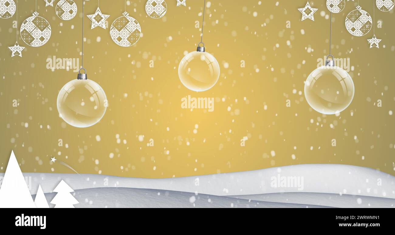 Image of christmas bubbles and snow falling on yellow background Stock ...