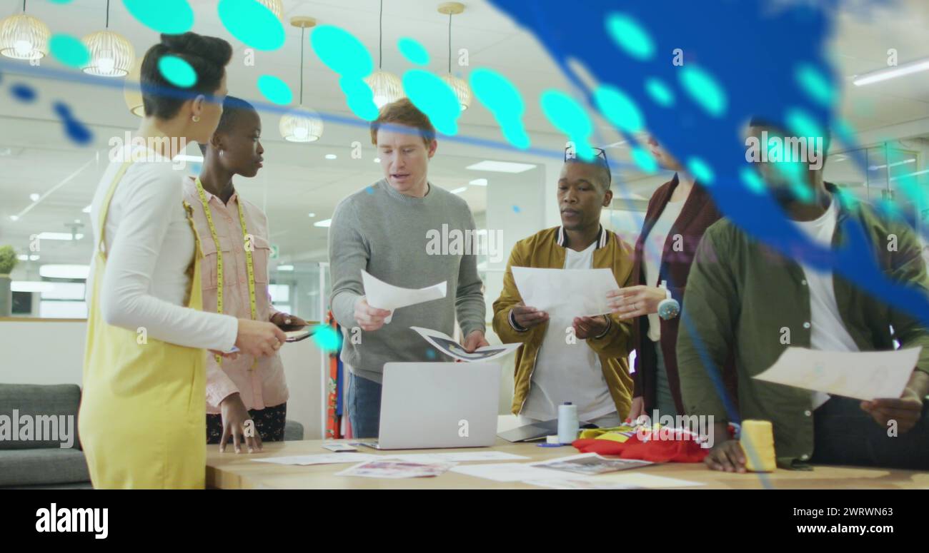 Image of graphs, changing numbers and map over diverse coworkers ...