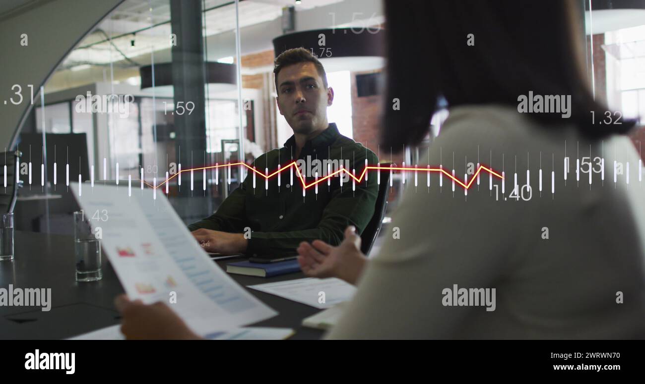 Image of graph and changing numbers over diverse coworkers discussing ...