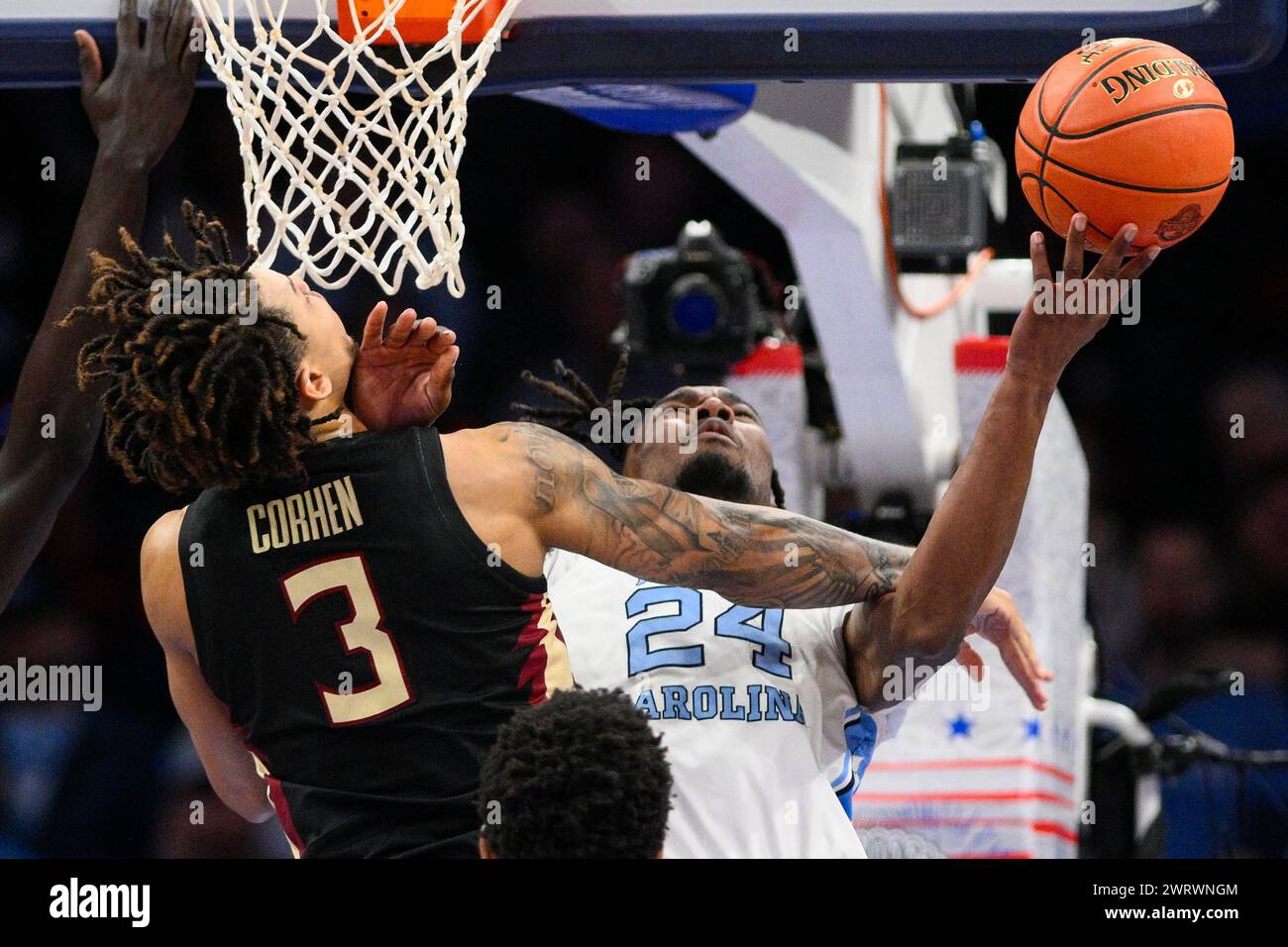 Florida State forward Cam Corhen (3) fouls North Carolina forward Jae ...