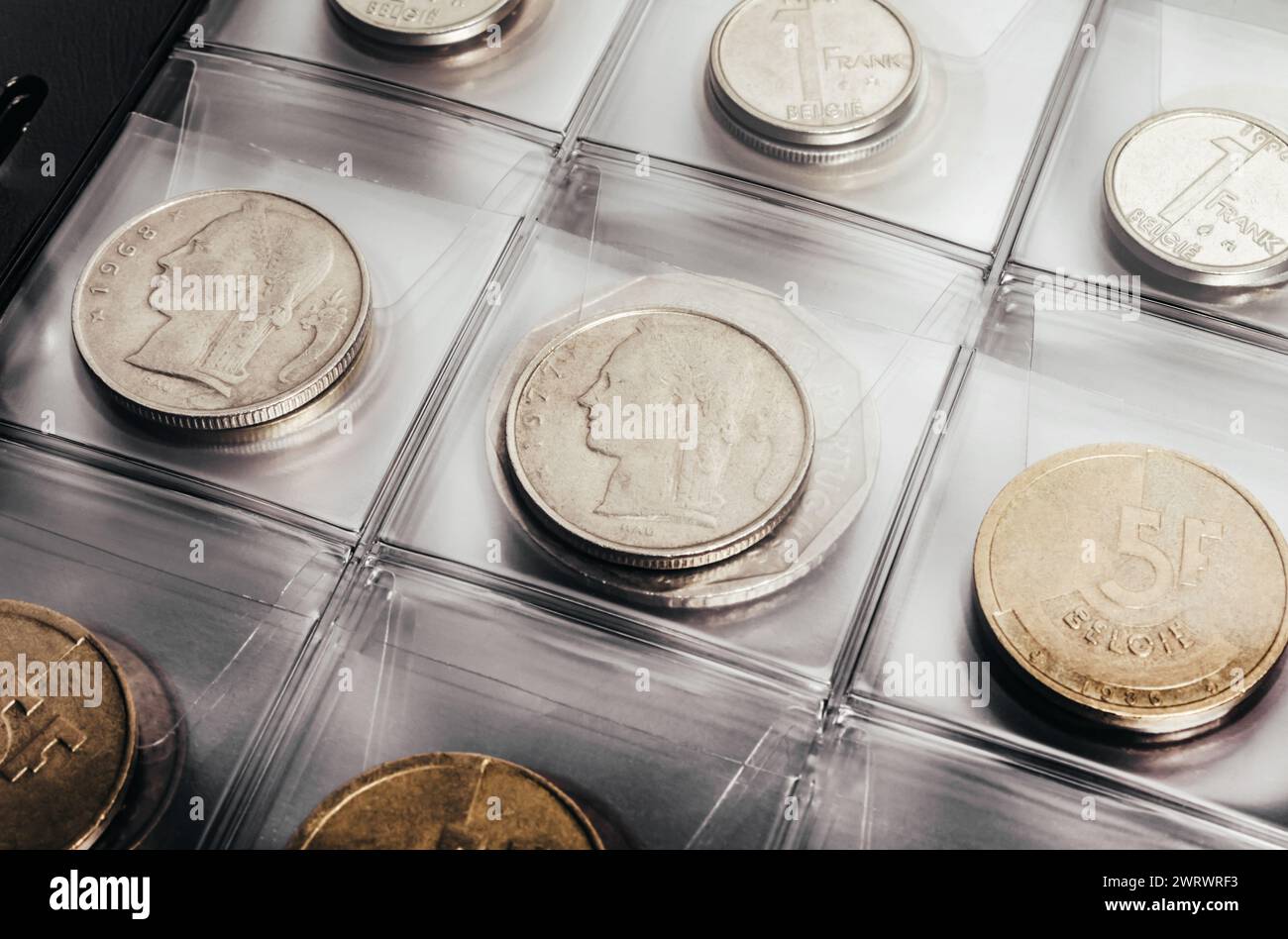 Photo of a belgian old coins collection in a clear plastic sheet holder ...