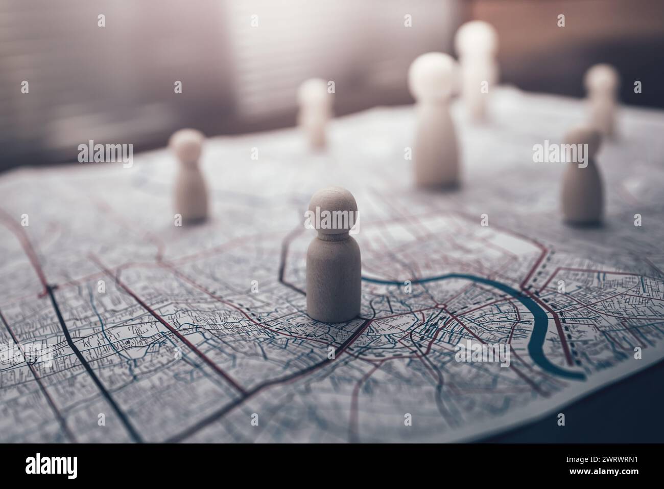 The wooden doll represents the employee of the company on route map ...