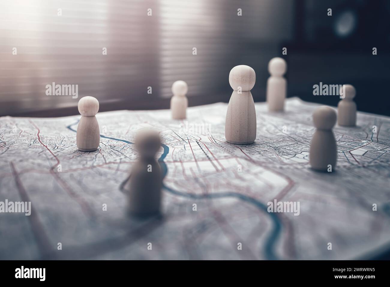 The wooden doll represents the employee of the company on route map ...