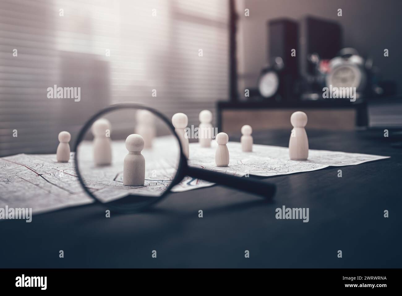 The wooden doll represents the employee of the company and magnifying ...