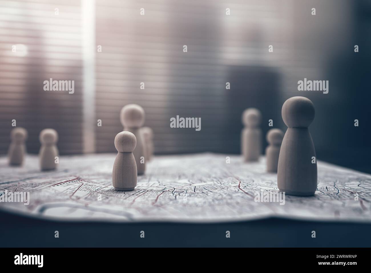 The wooden doll represents the employee of the company on route map ...