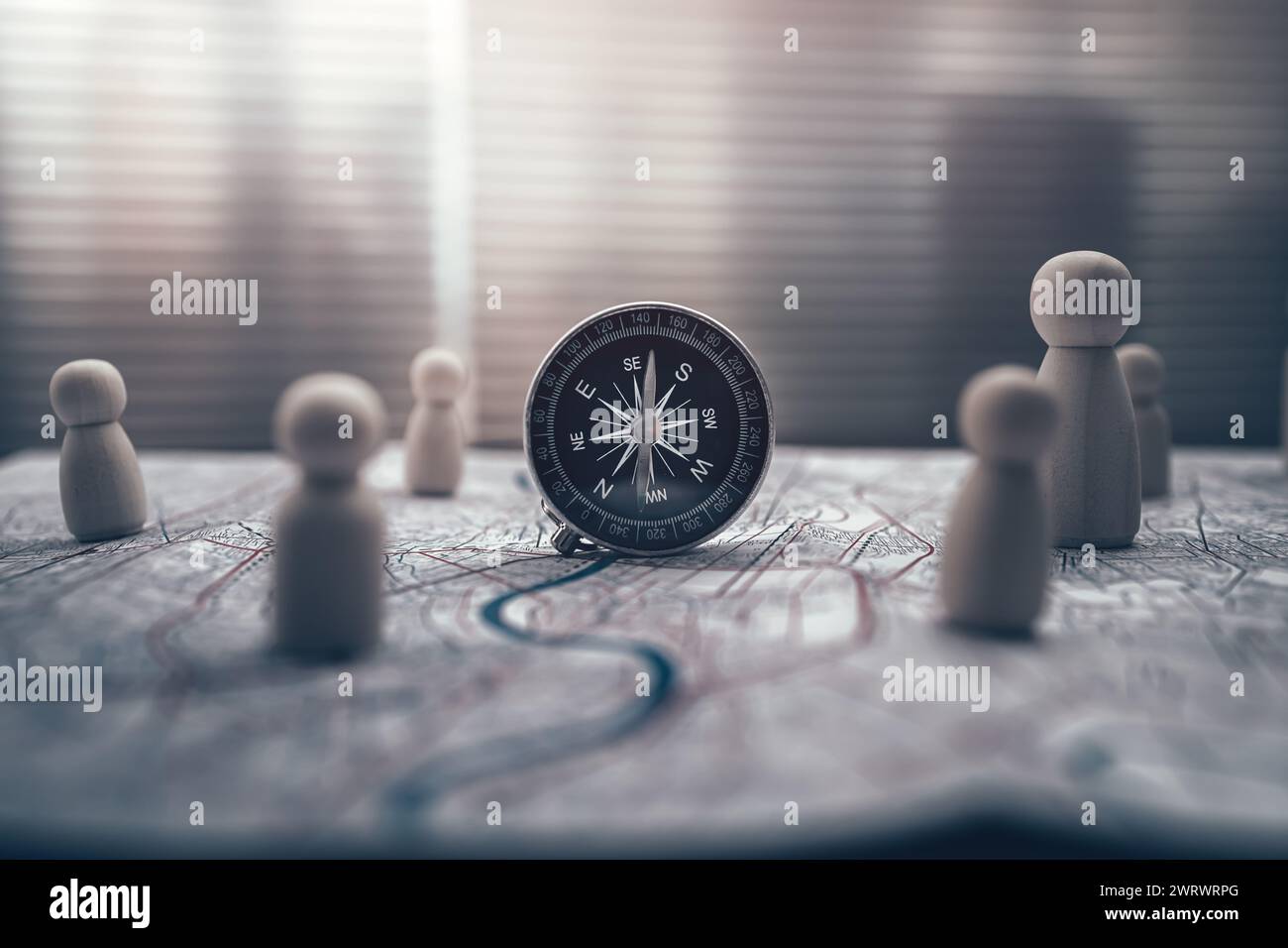 Compass and The wooden doll represents the employee of the company on ...