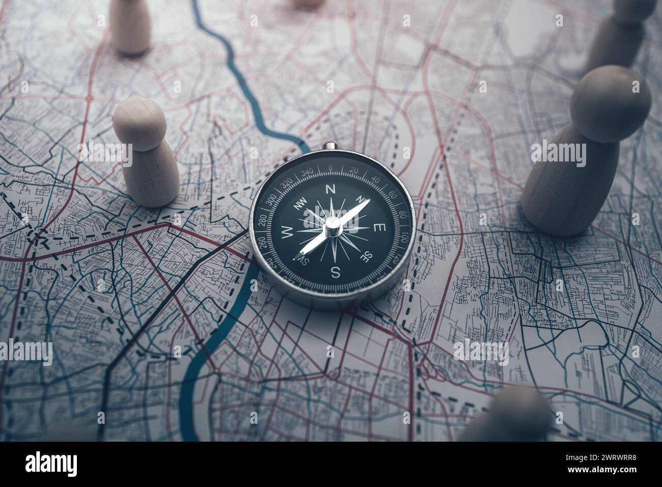 Compass and The wooden doll represents the employee of the company on ...