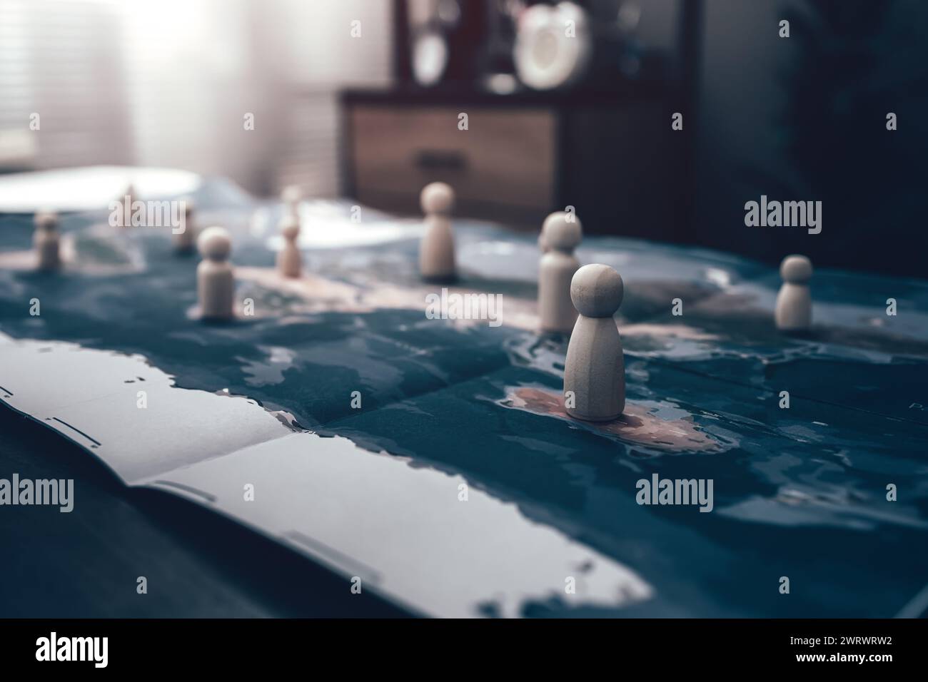 The wooden doll represents the employee of the company on world map ...