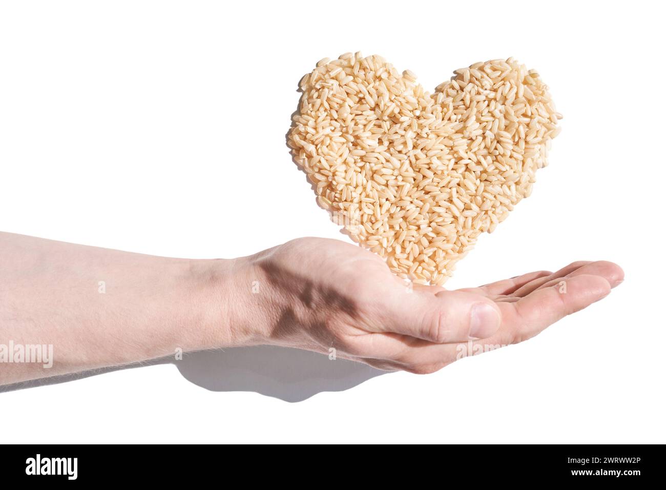 A heart-shaped rice pile, symbolizing love, unity, and hope. The grains ...