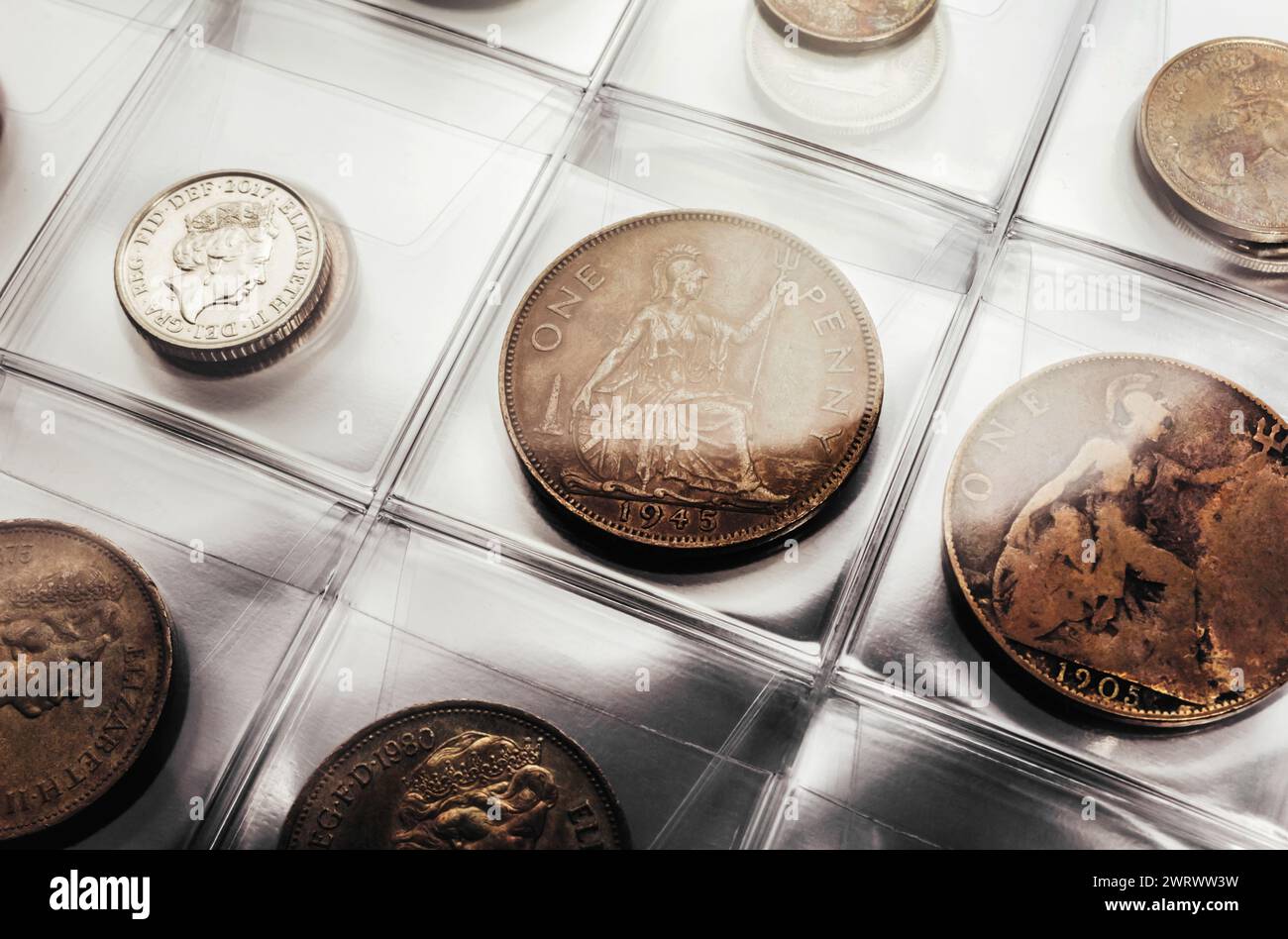 Photo of UK old british coins collection in a clear plastic sheet ...