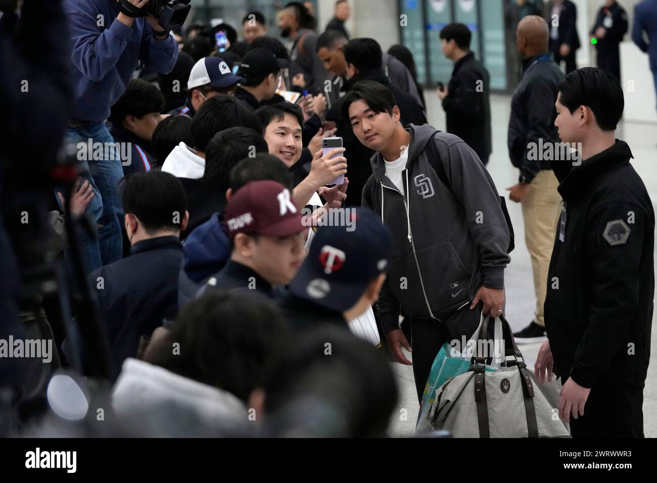 San Diego Padres player Woo-Suk Go, right, interacts with fans as he ...