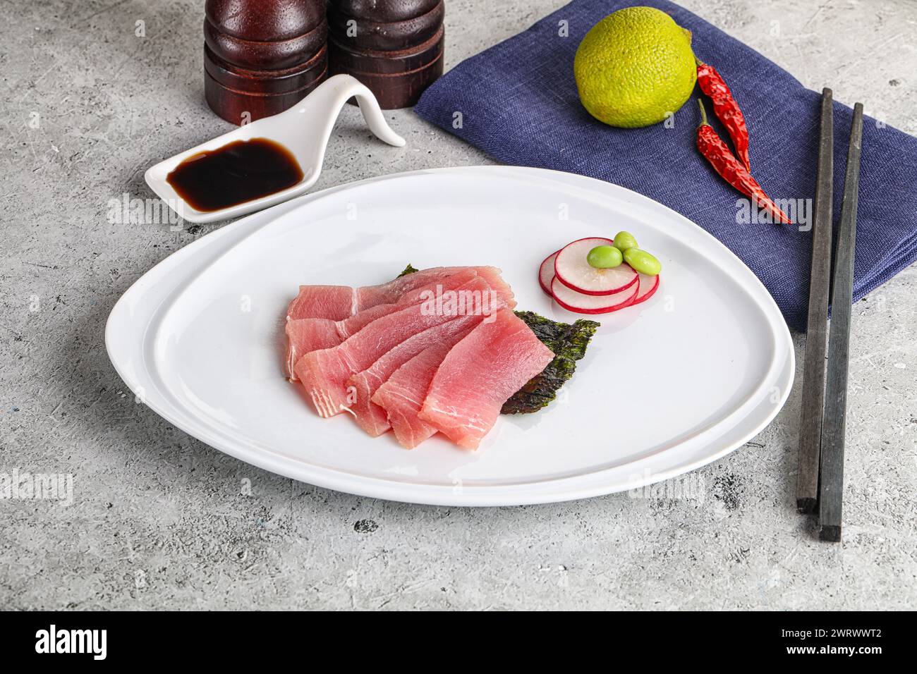 Japanese cuisine - sliced raw tuna sashimi Stock Photo - Alamy