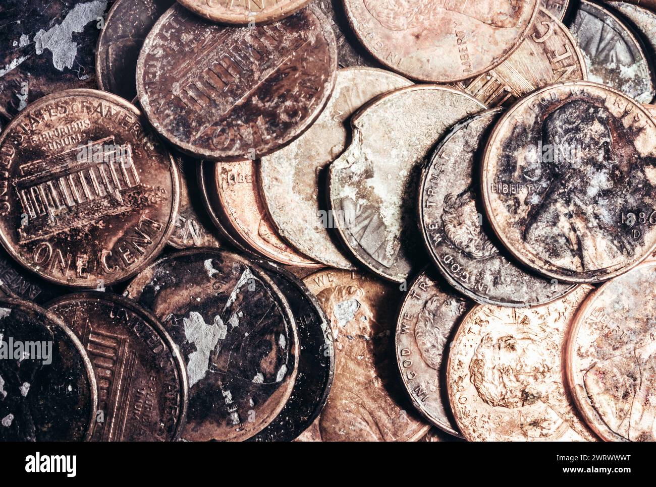 Photo of a pile of american Lincoln cent, penny damaged and rusty coins ...