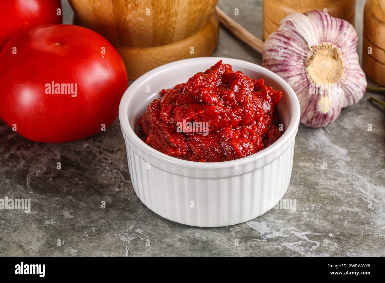 Natural organic red tomato paste in the bowl Stock Photo - Alamy