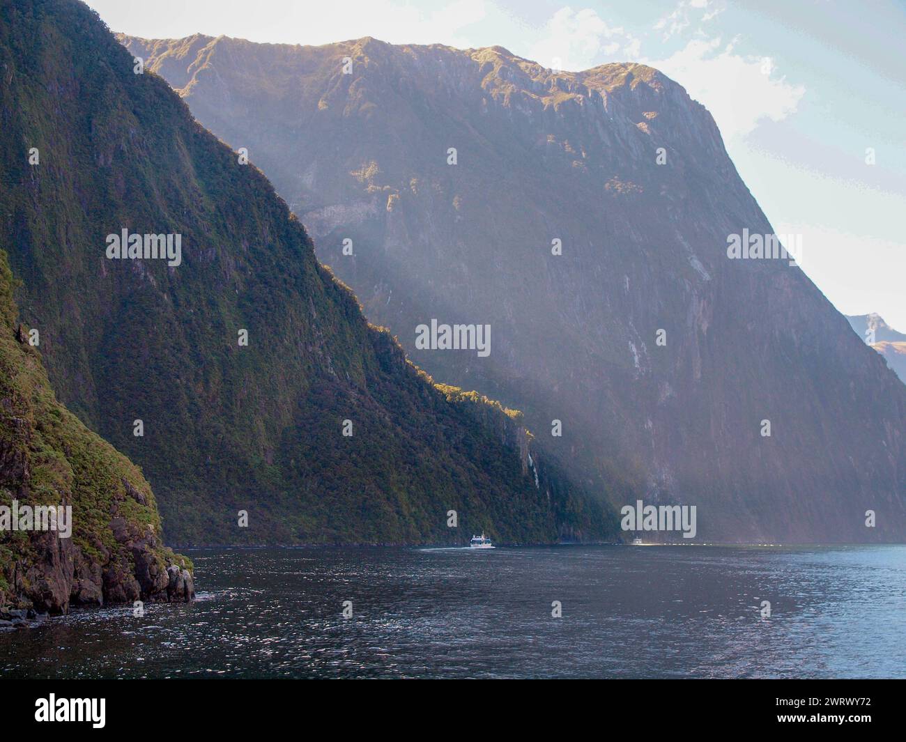 Sunshine above the fjord, Milford Sound - New Zealand Stock Photo - Alamy
