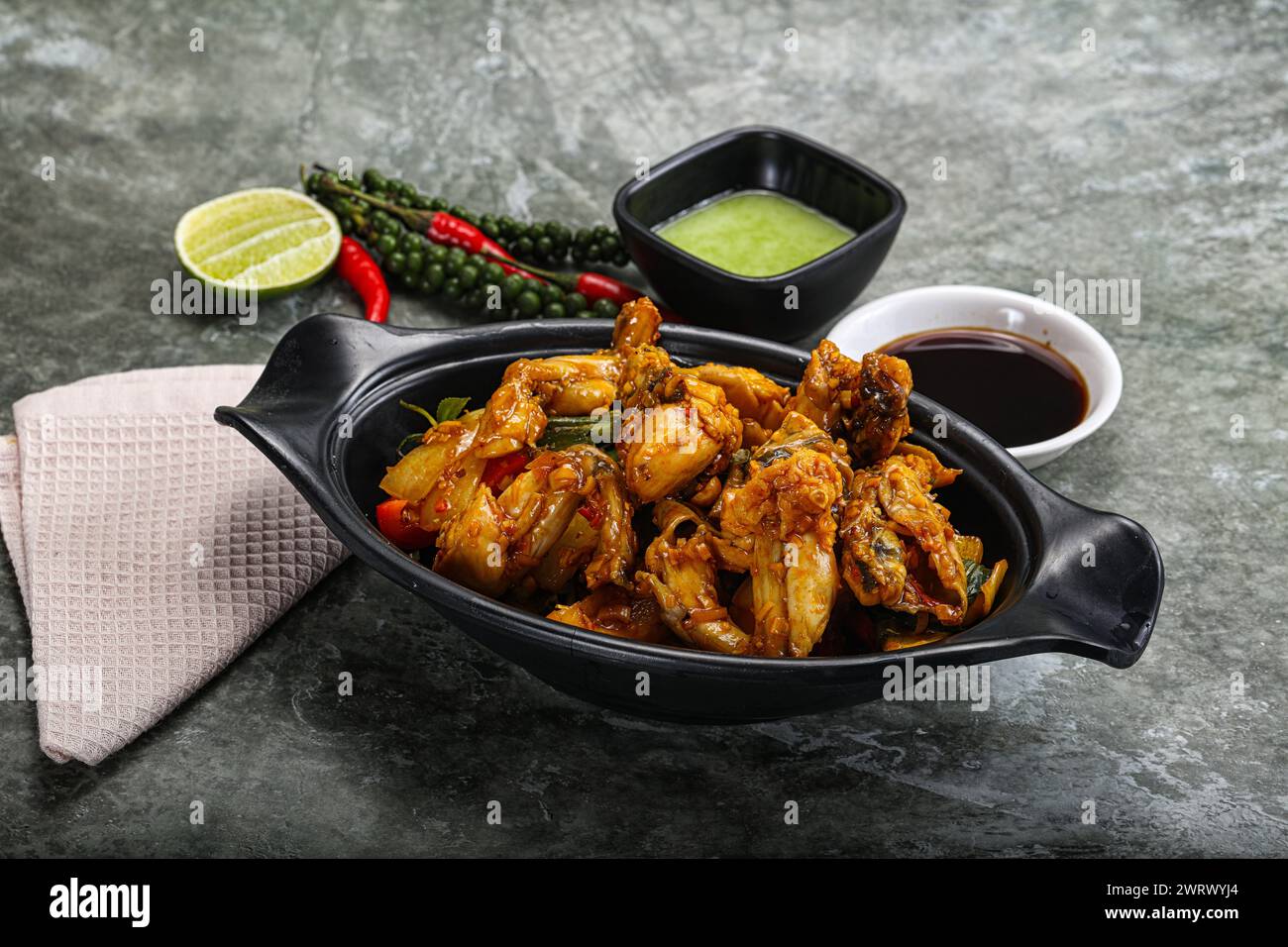 Vietnamese cuisine - fried frog with vegetables and spices Stock Photo ...
