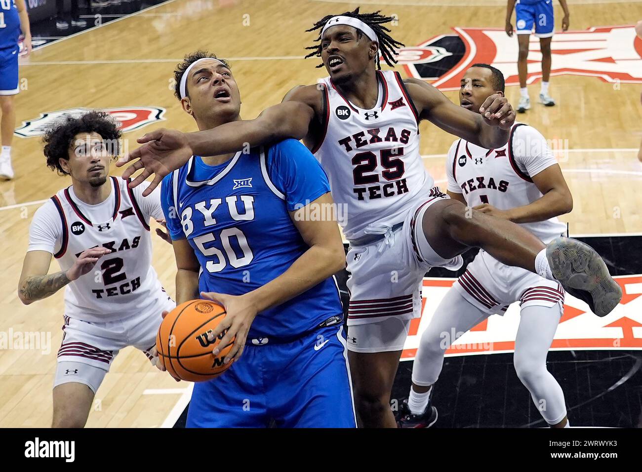 BYU center Aly Khalifa (50) looks to shoot under pressure from Texas ...