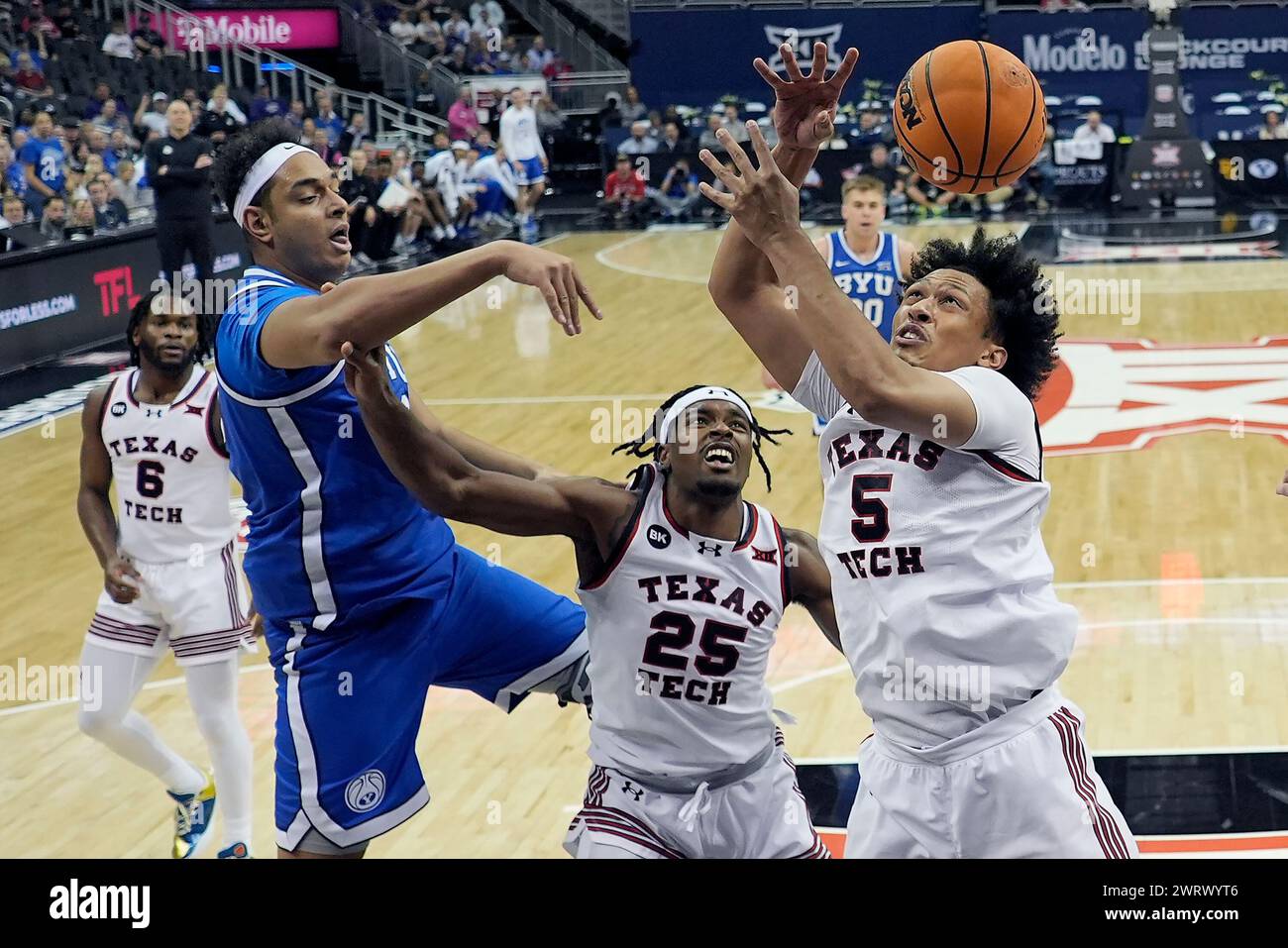 BYU center Aly Khalifa (50) passes over Texas Tech guard Darrion ...