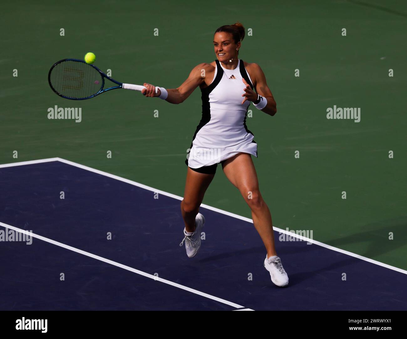 March 13, 2024 Maria Sakkari of Greece returns a shot against Diane ...