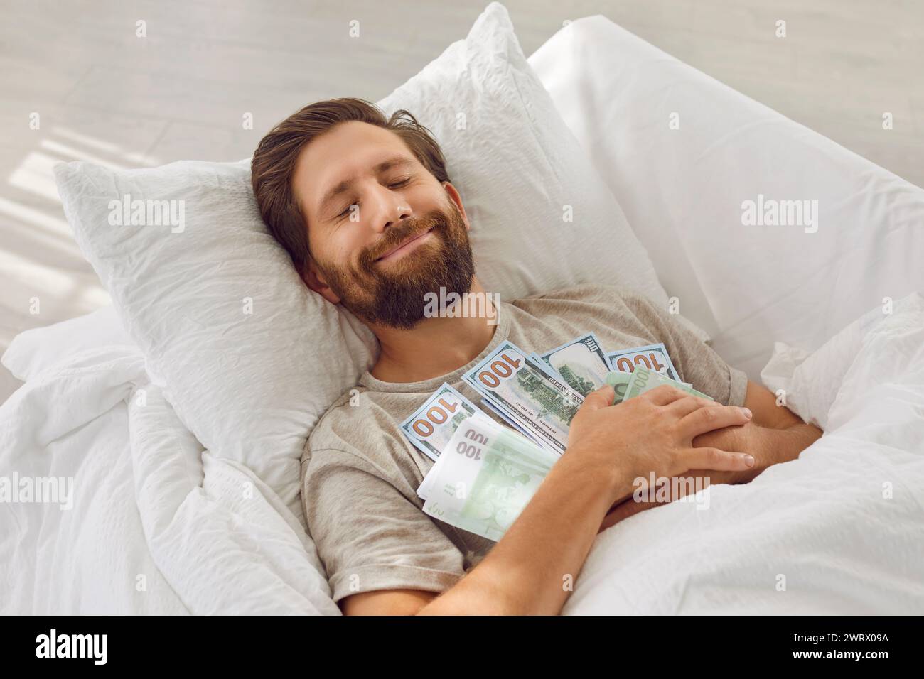 Money sleeping wealth young hi-res stock photography and images - Alamy